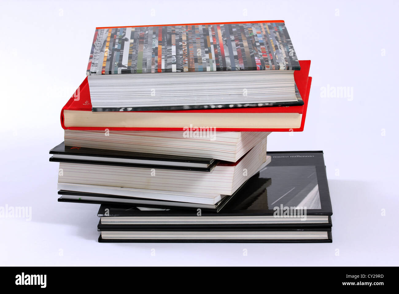 books piled up, against a clear white background, studio shot ...