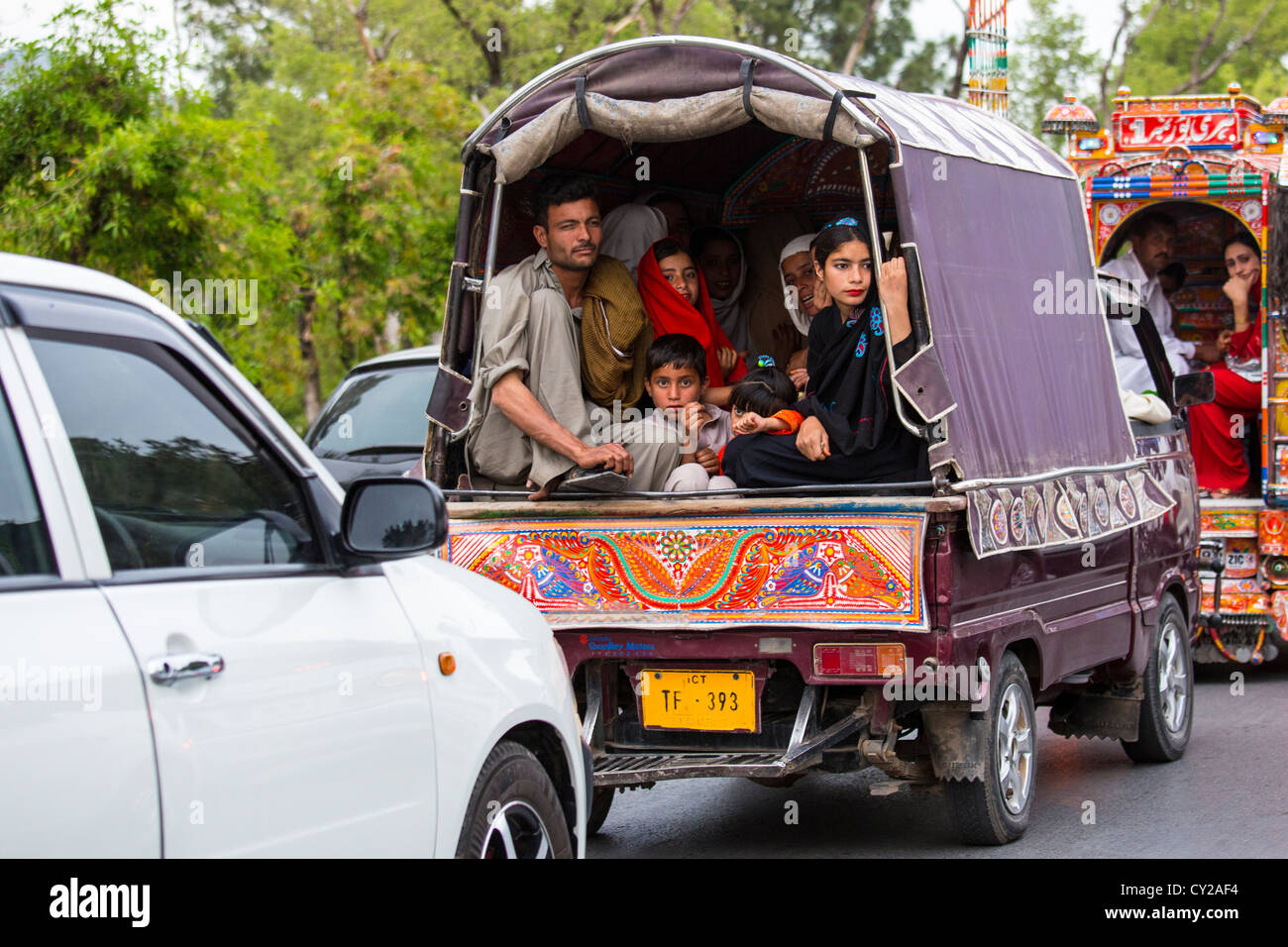 Pakistani family riding in a public transportation truck, Islamabad ...