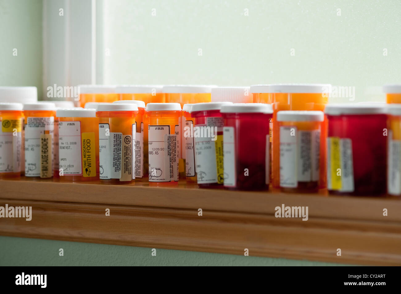 Pills and pill bottles along window sill Stock Photo - Alamy