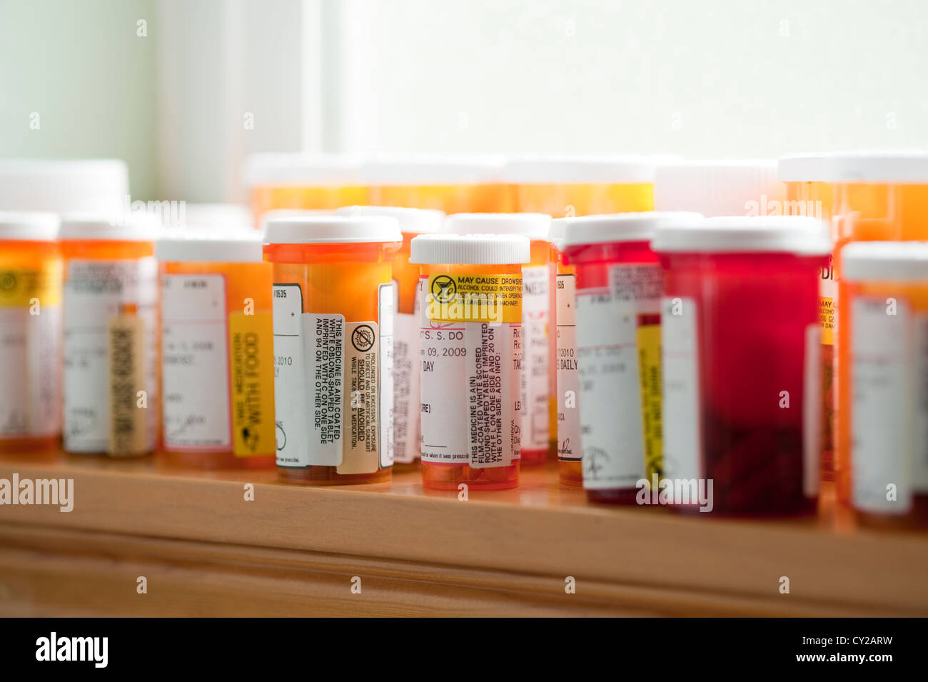 Pills and pill bottles along window sill Stock Photo - Alamy
