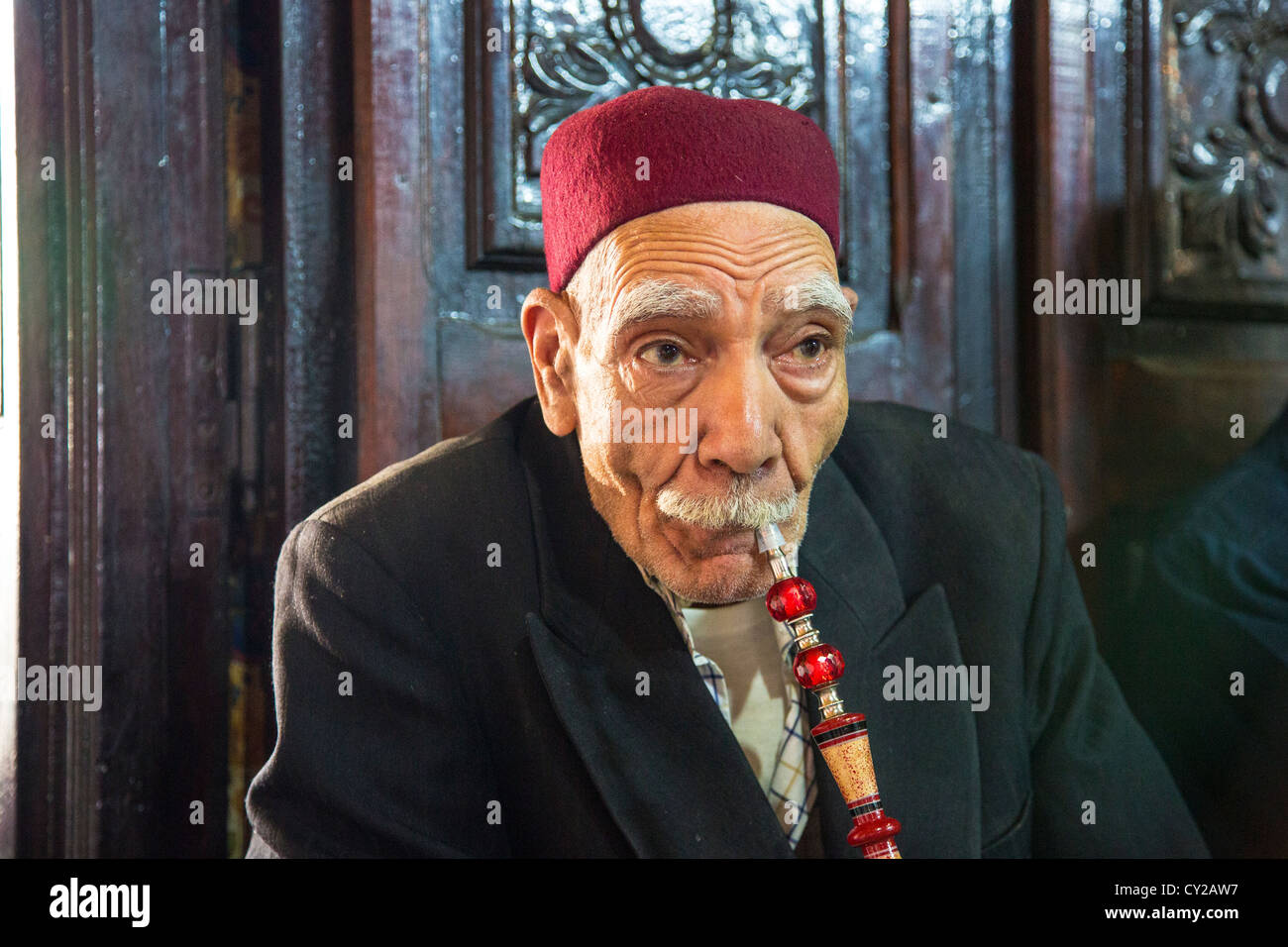 Smoking a sheesha at Cafe Ezzitouna, Tunis Medina, Tunis, Tunisia Stock ...