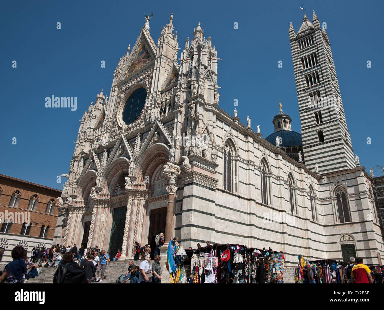 Tourists outside the famous cathedral of St Mary of the Assumption ...