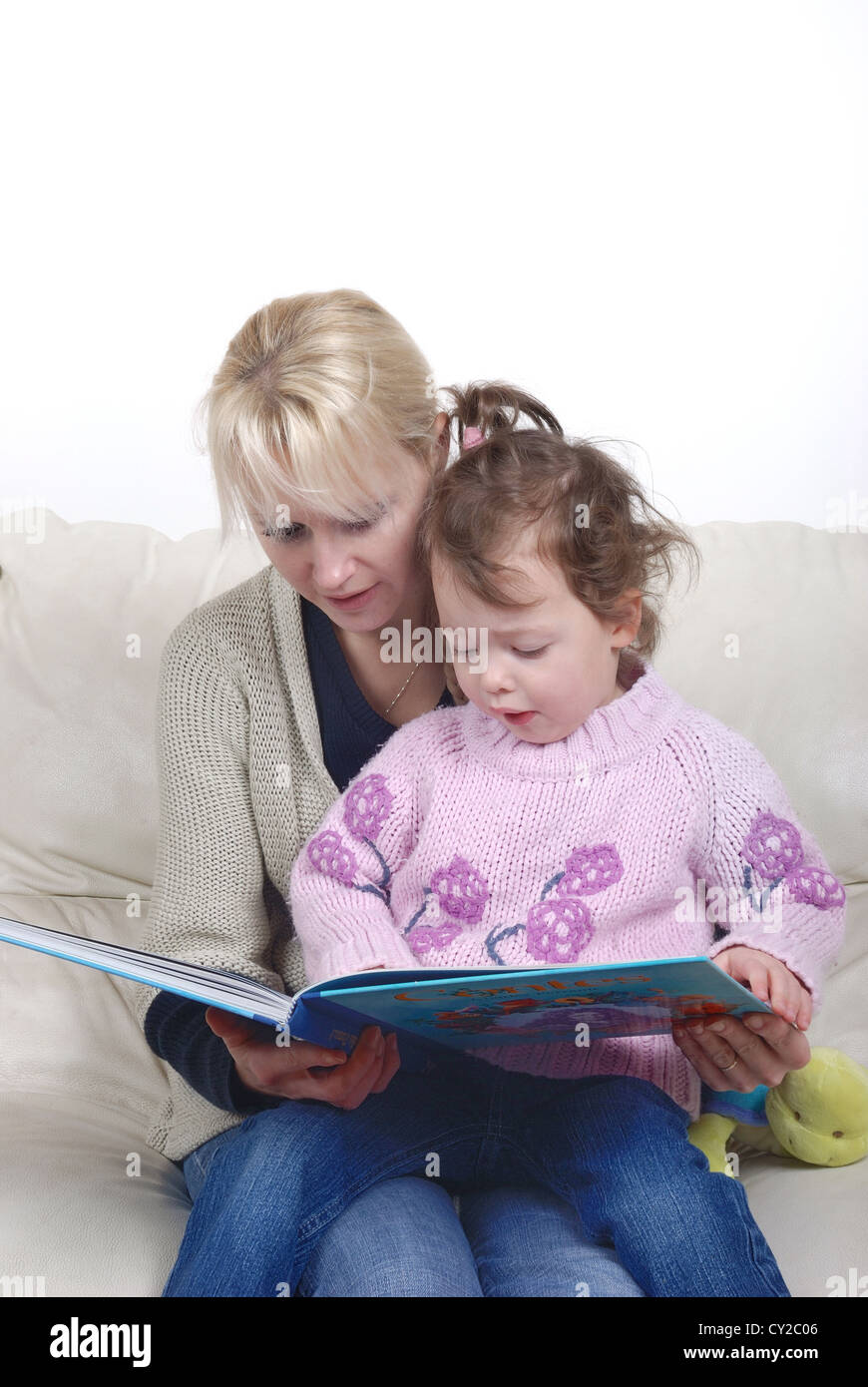 Loving mother daughter reading book hi-res stock photography and images ...