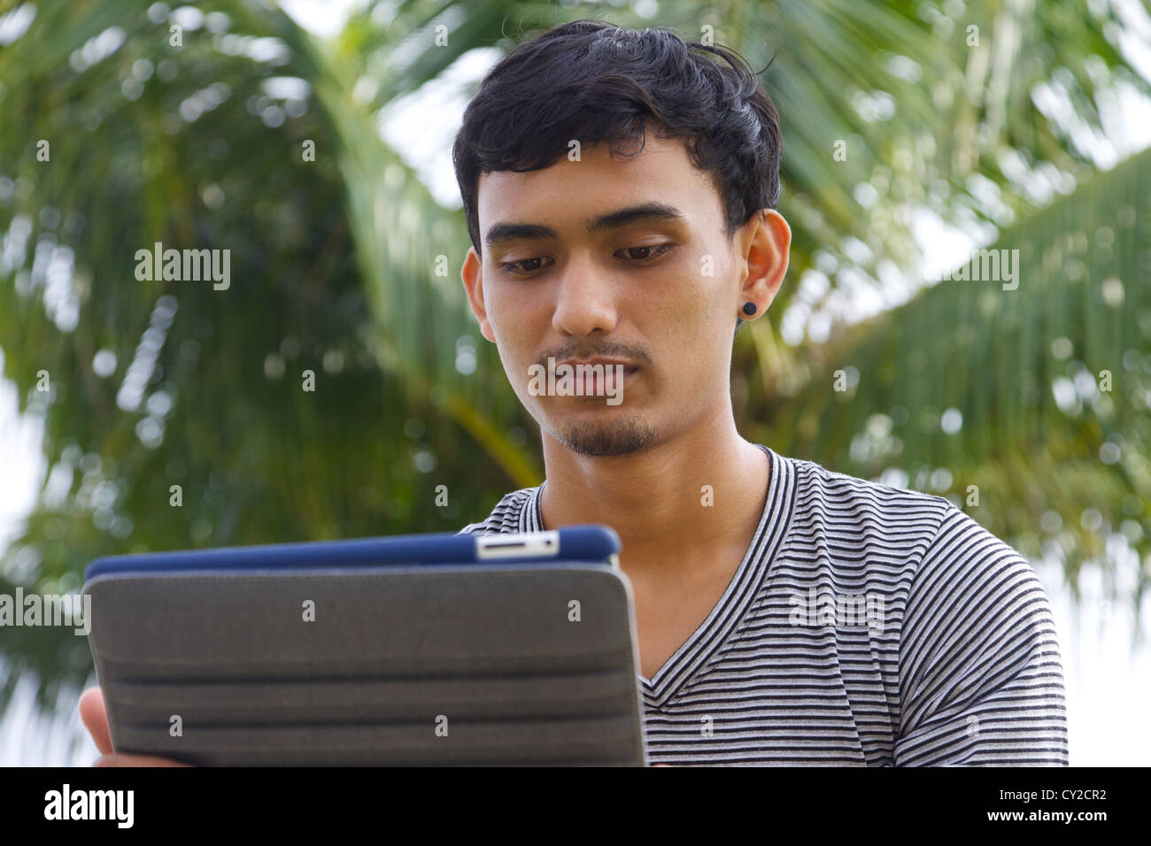 Asian boy using ipad hi-res stock photography and images - Alamy