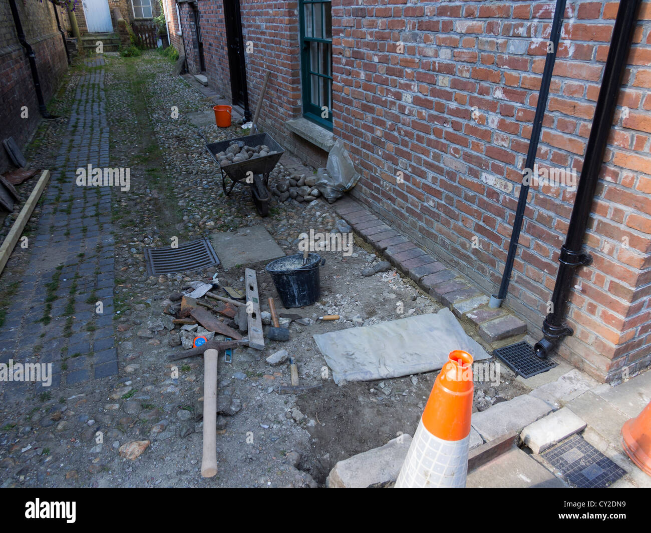 Repairing a cobblestone street Stock Photo - Alamy