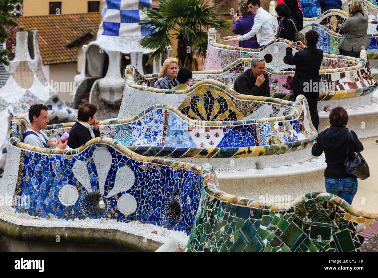 People enjoying art nouveau mosaic tile benches designed by Antonio ...