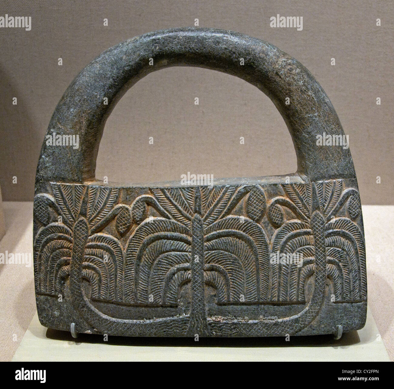 Object with a handle, perhaps a weight; palm trees and guillochePersian ...