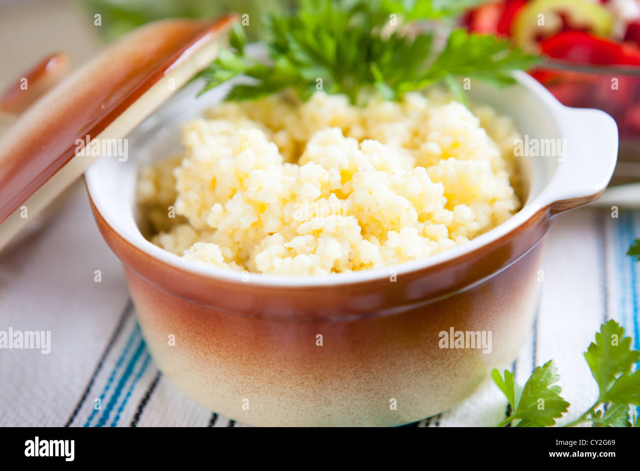 Porridge of millet in a ceramic pot Stock Photo - Alamy