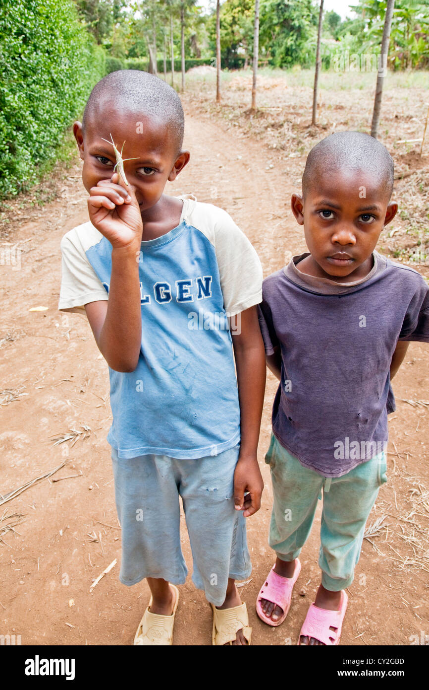 Two African Children playing on the street in Moshi;Tanzania;East ...
