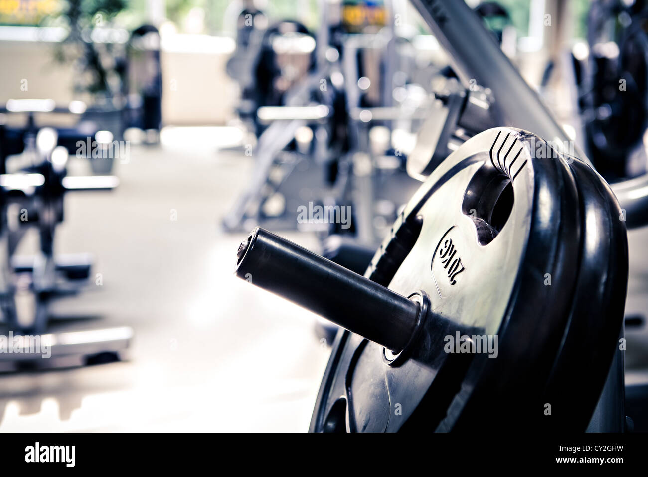 diverse equipment and machines at the gym room Stock Photo - Alamy