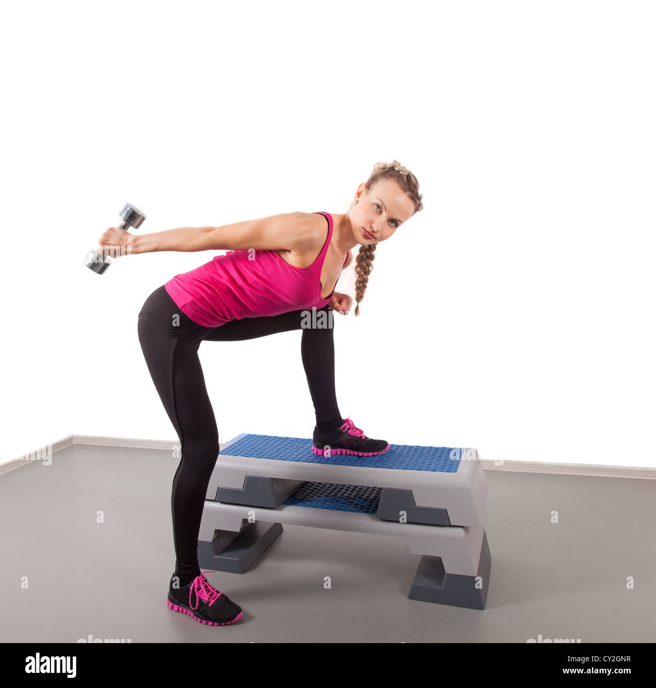 Athletic young woman training with dumbbell in the gym Stock Photo - Alamy