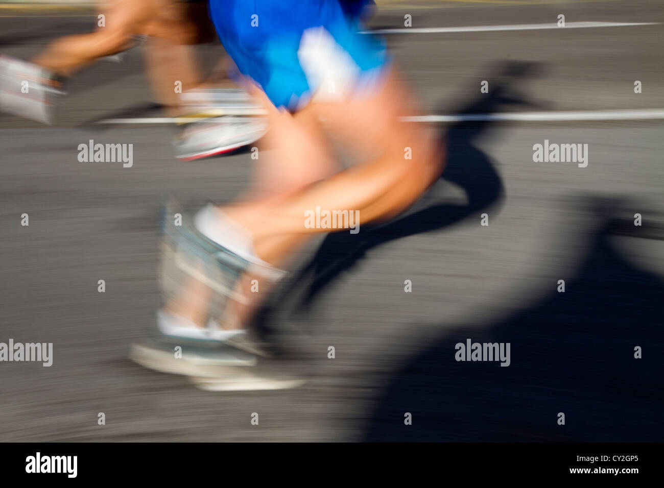 runners legs blurred motion athletes Marathon running on road Stock ...