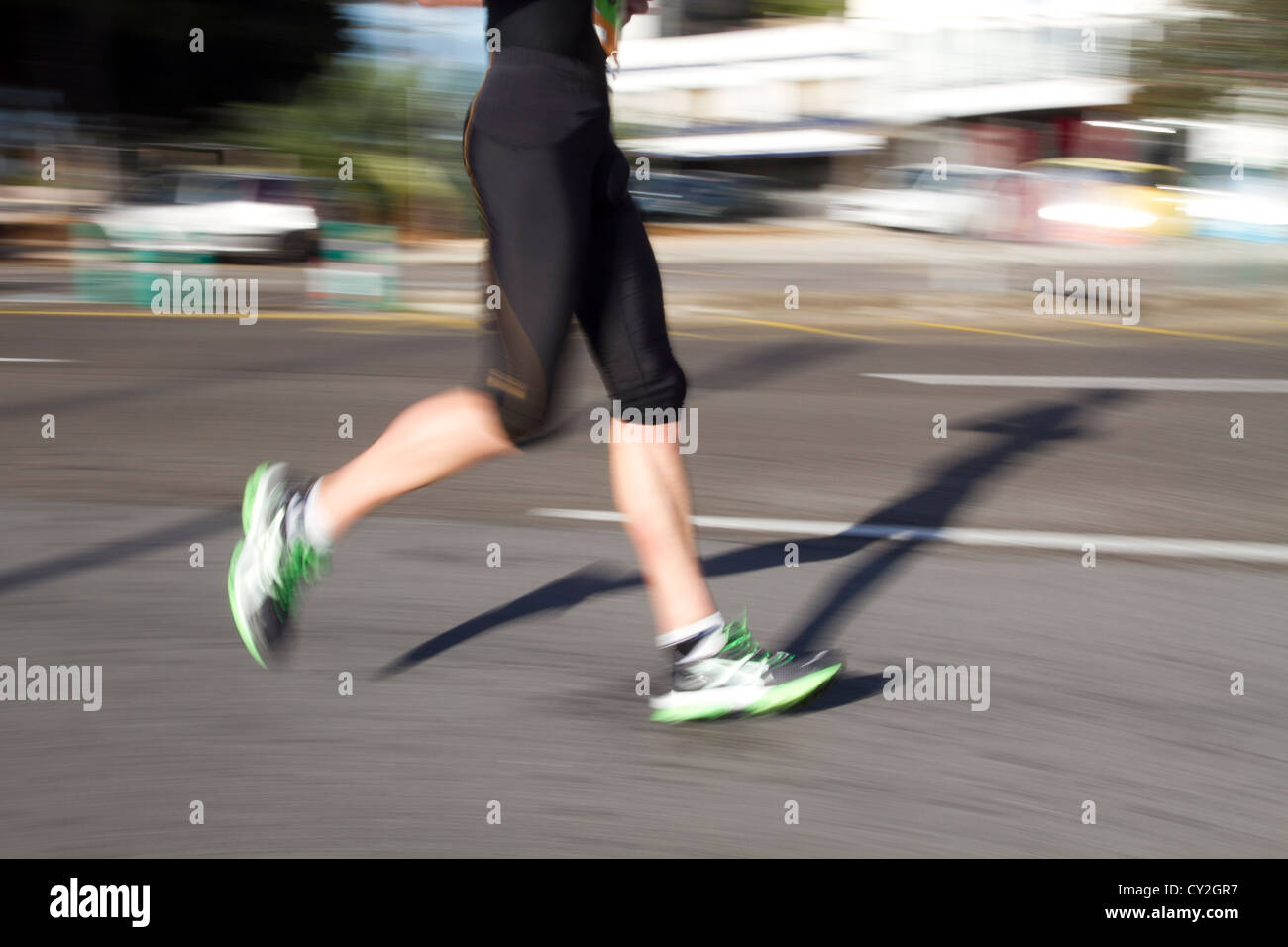 runner legs athlete Marathon running blurred motion on road Stock Photo ...