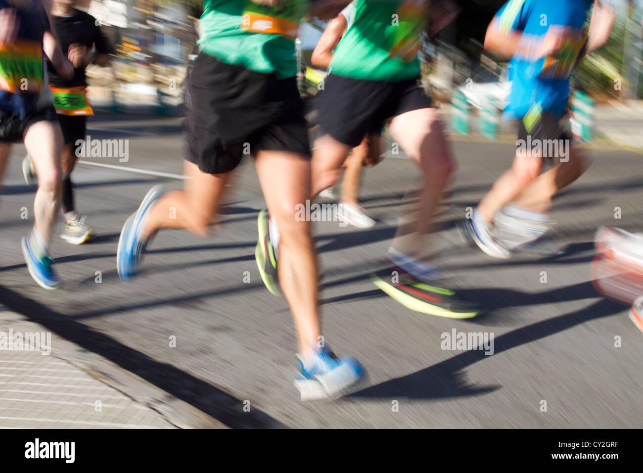 runners legs blurred motion Marathon running on road athletes racing ...