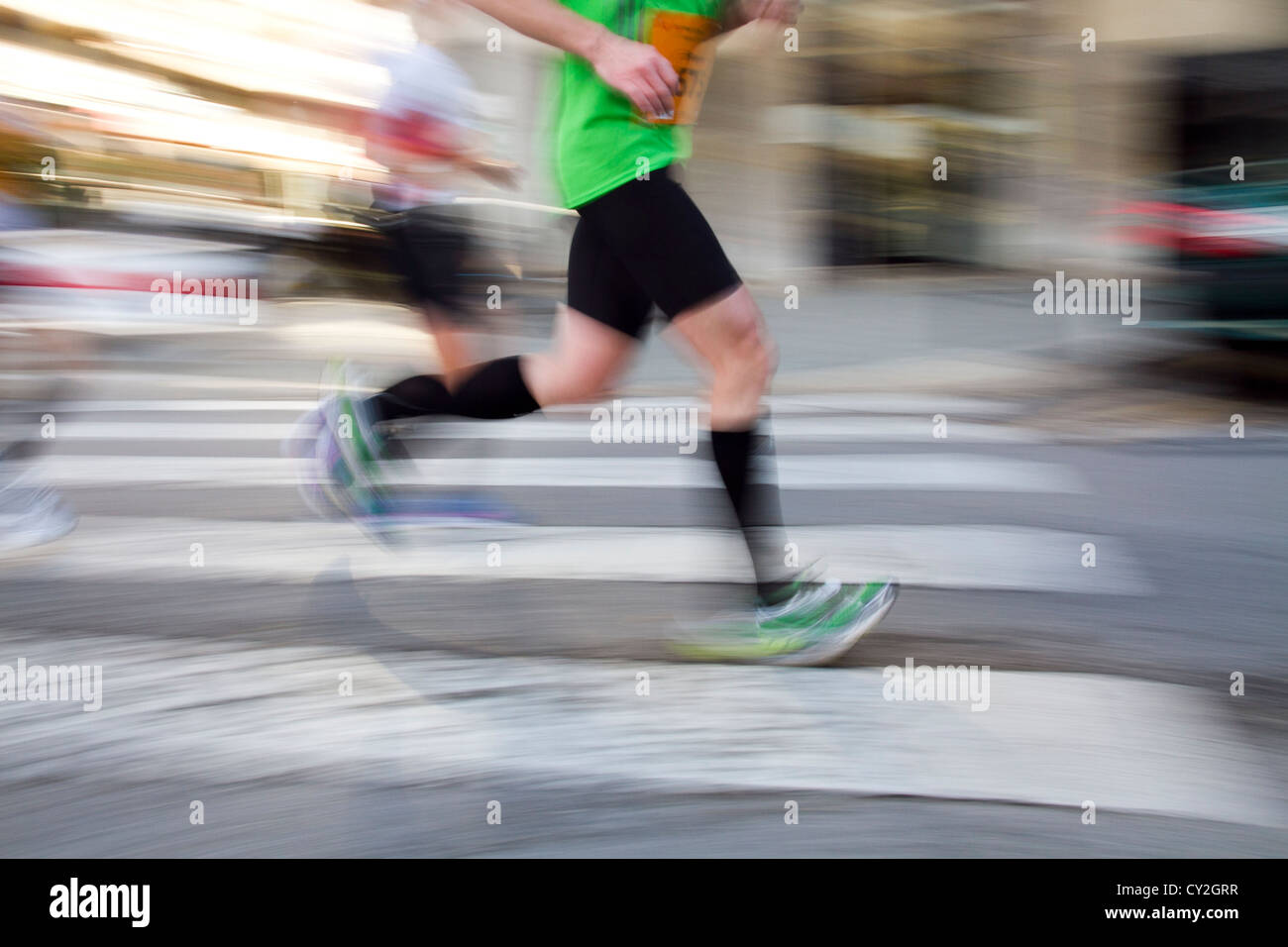 runner legs blurred motion athlete Marathon running on road Stock Photo ...