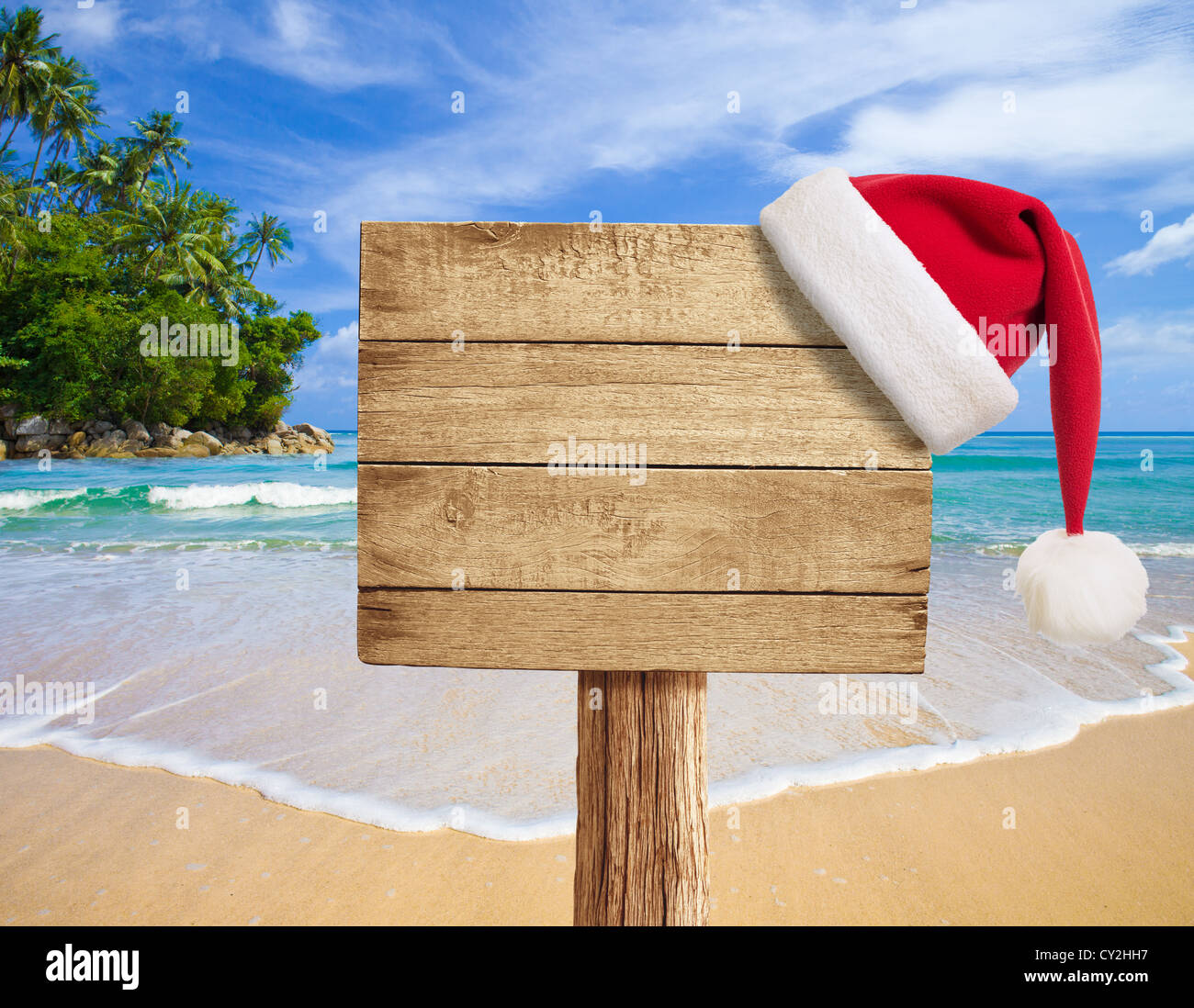 tropical beach wooden signboard with Christmas hat Stock Photo - Alamy