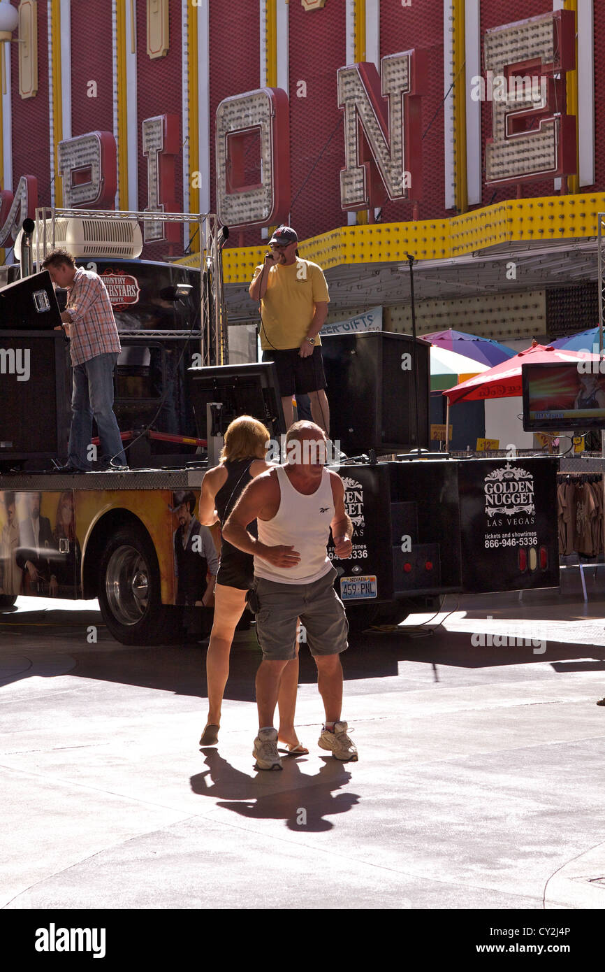 An impromptu karaoke show on Fremont Street with passers by joining in ...