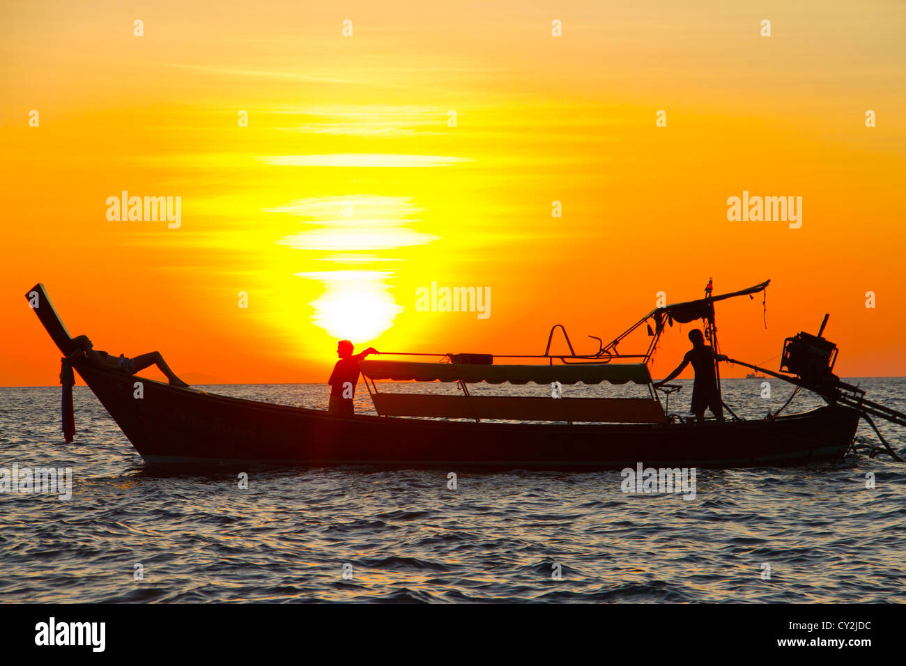 Relaxing boat at the sea, in a sunset landscape Stock Photo - Alamy