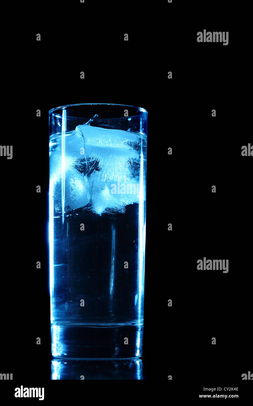 Half full glass of water with ice hi-res stock photography and images ...