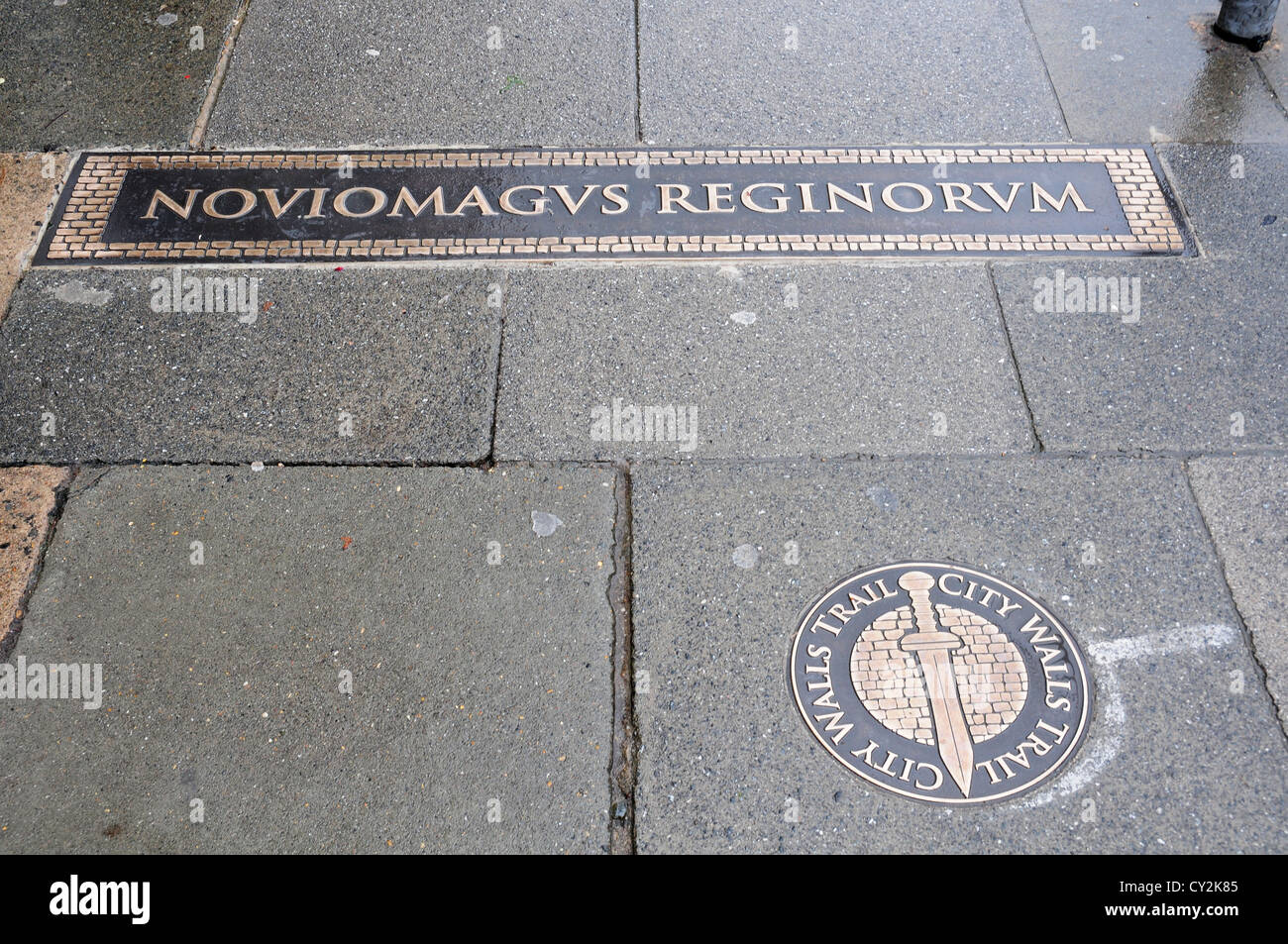 Direction sign for City Walls Walk, together with Chichester's Roman ...