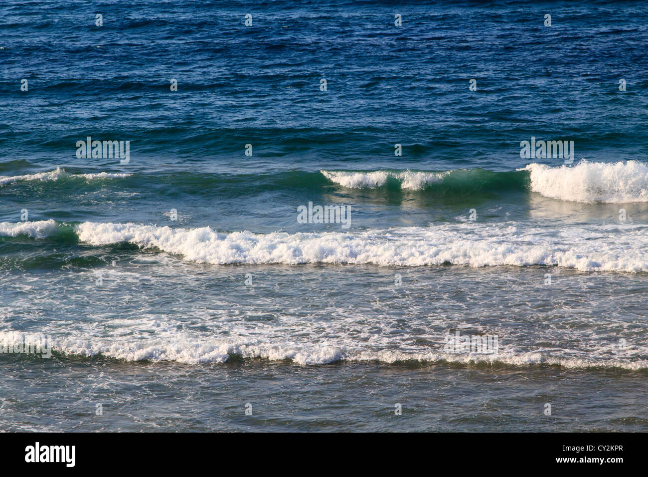 Incoming waves at the beach of Crete Stock Photo - Alamy