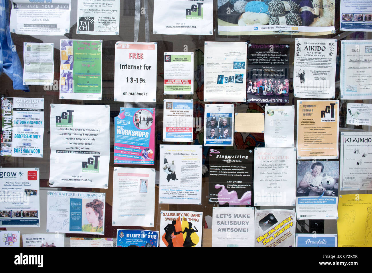 Posters and flyers in shop window Stock Photo - Alamy