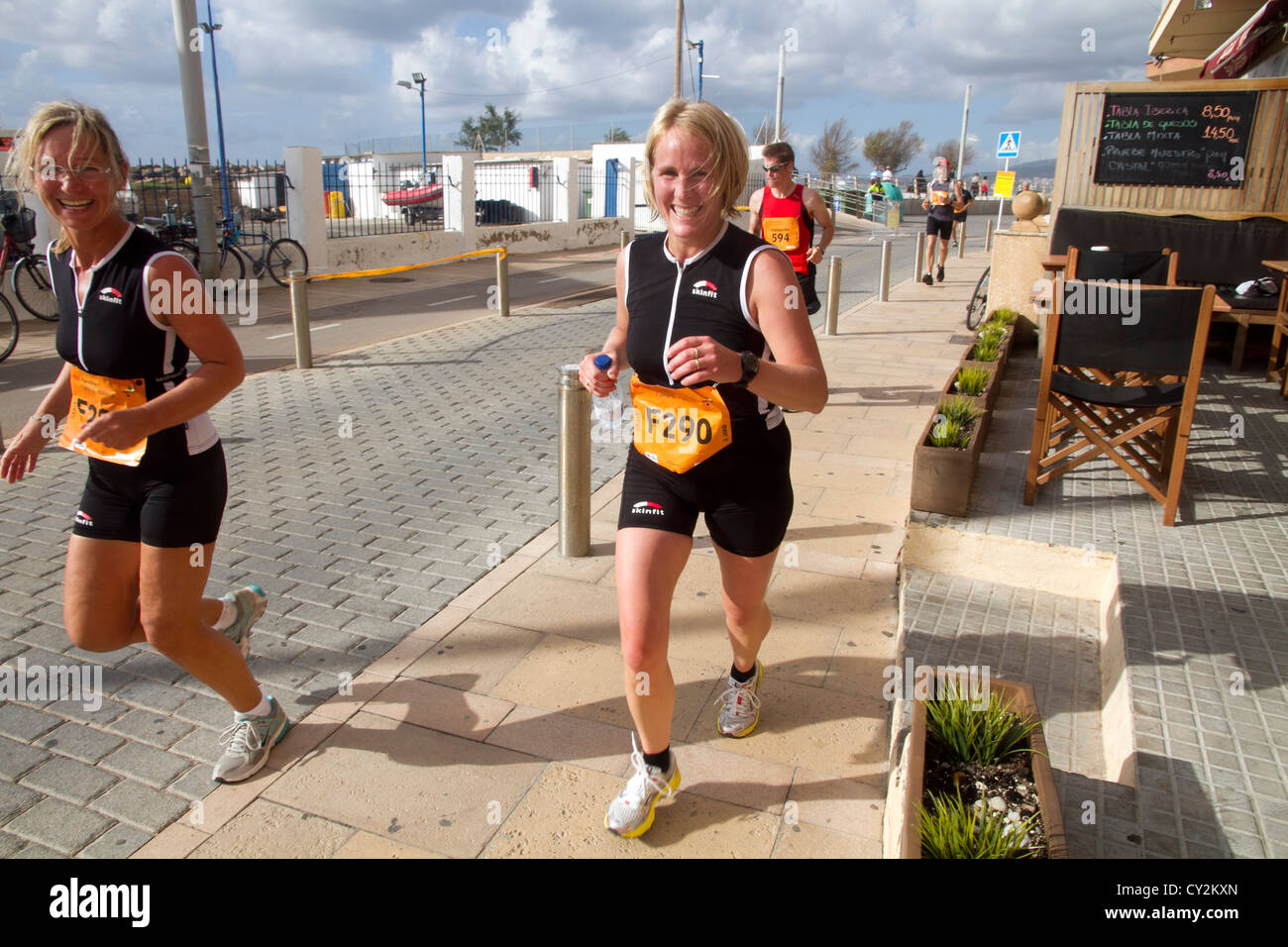 Marathon runners women race athletes running on road Palma de Mallorca ...
