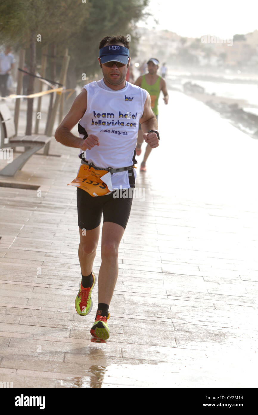 Marathon runner race athlete running on promenade sea road Palma de ...