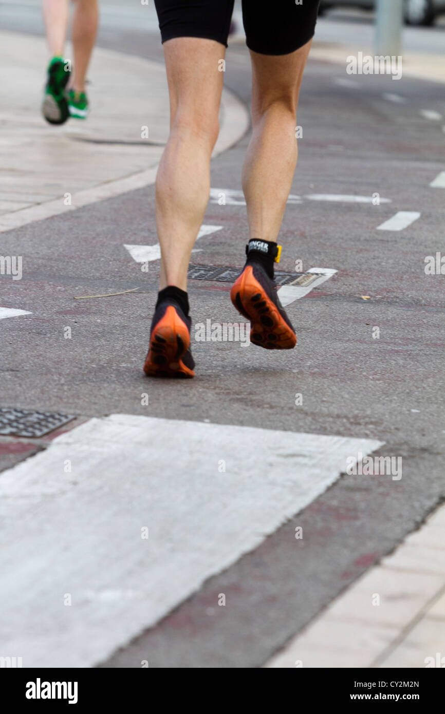 runner legs running on road athlete Marathon Stock Photo - Alamy