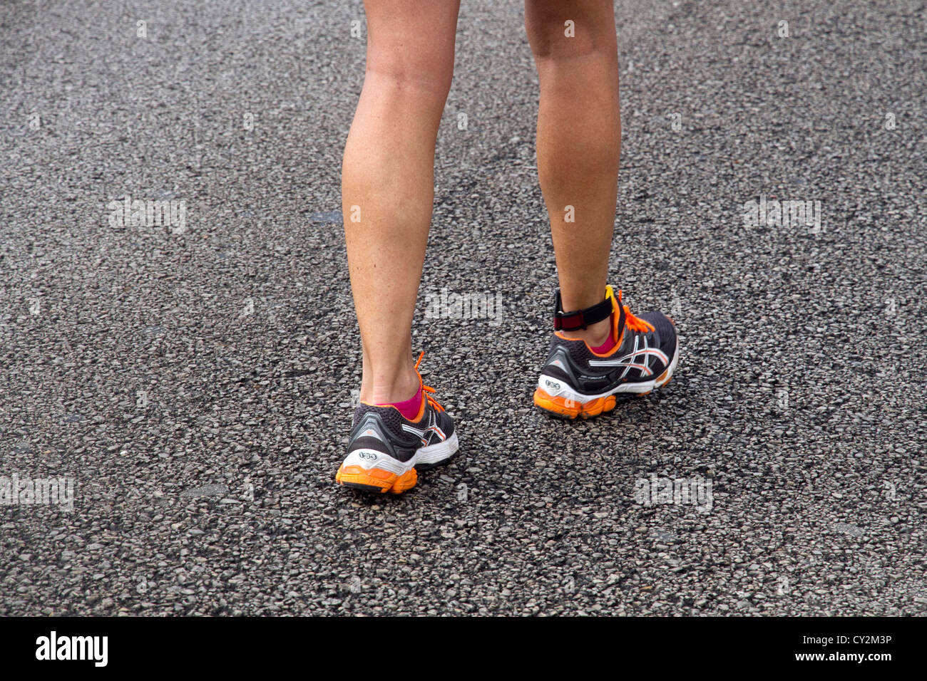 runner legs woman running on road athlete Marathon Stock Photo - Alamy