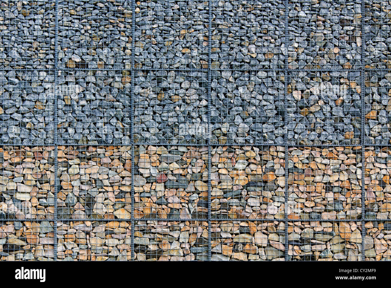 A large wall of stacked stones in different colors Stock Photo - Alamy