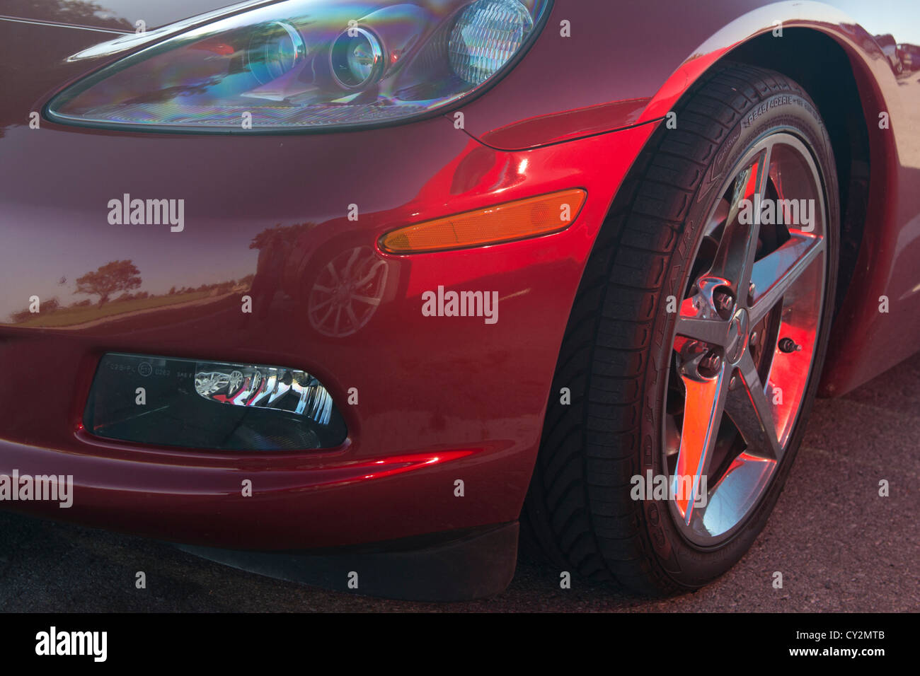 Front left fender and tire of a red Chevrolet Corvette sports car Stock ...
