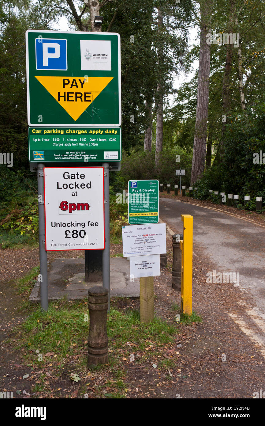 A sign to alert public park users that parking charges apply daily. The ...