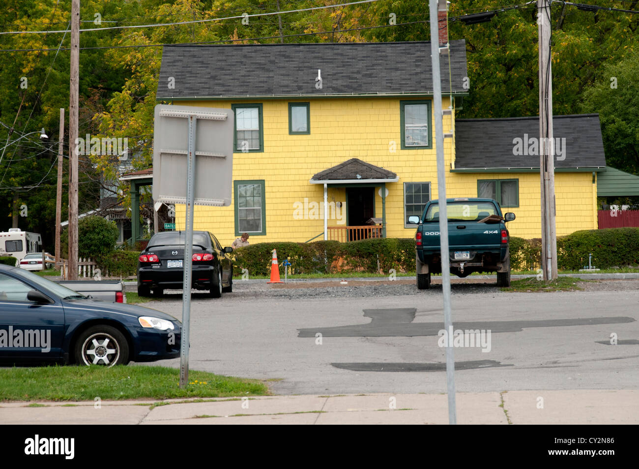 Yellow house at intersection Stock Photo - Alamy