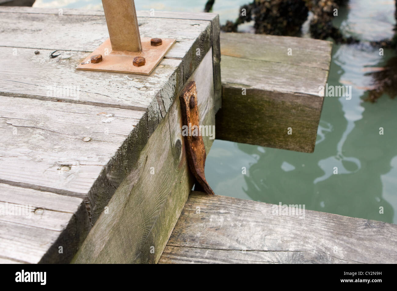 Detail of a bridge joint with rusted metal connections and post Stock ...