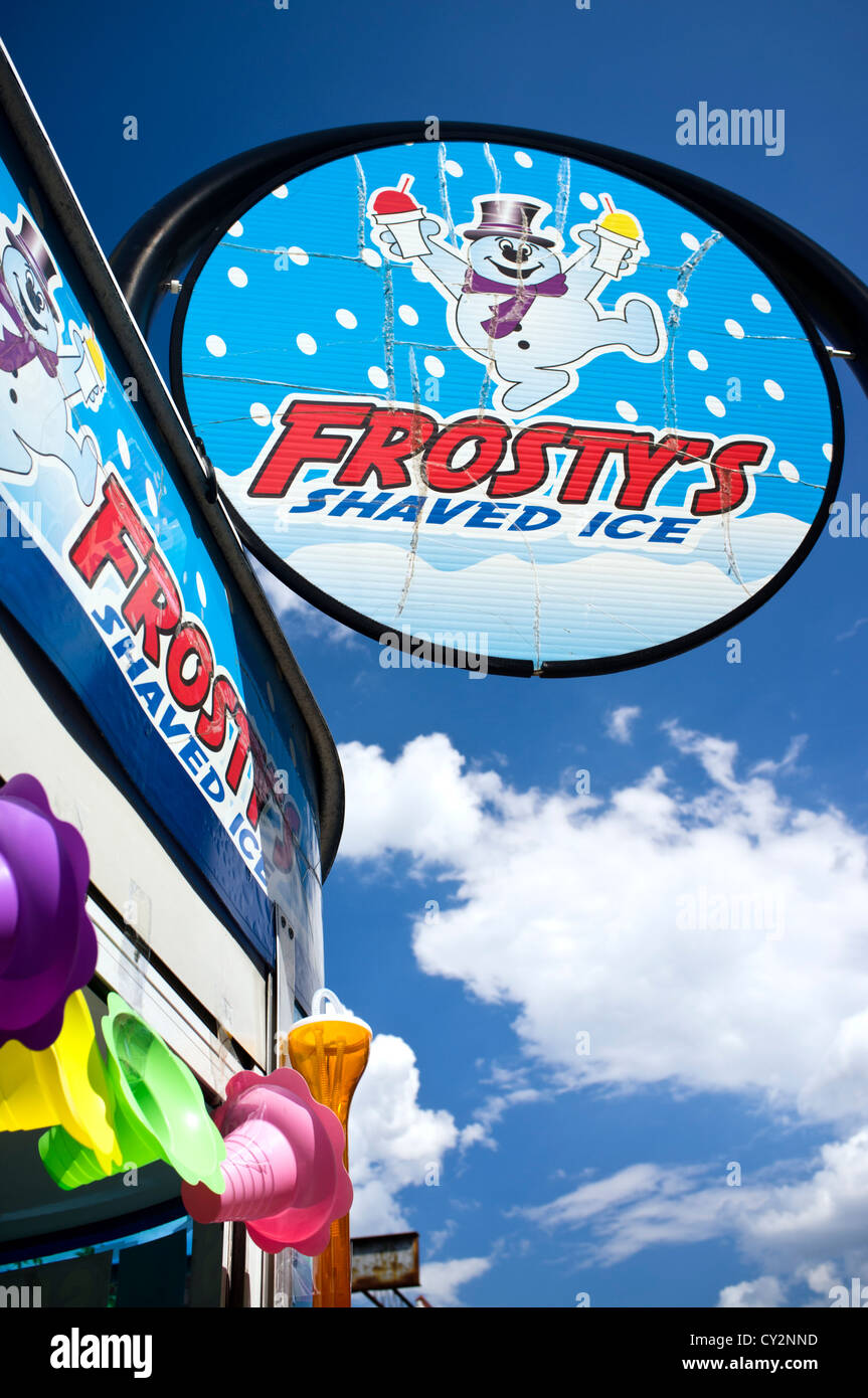 A flavored ice vendor at a festival with blue sky background Stock ...
