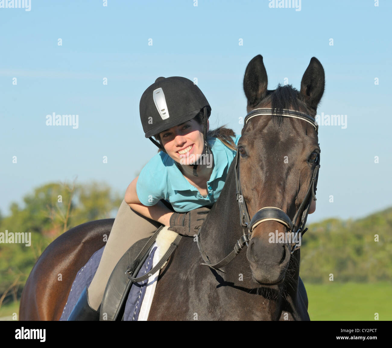 Happy young rider on back of a Hanoverian horse Stock Photo - Alamy