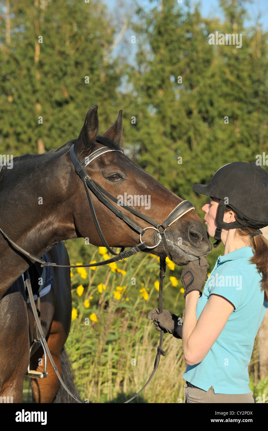 Rider loving her horse Stock Photo - Alamy