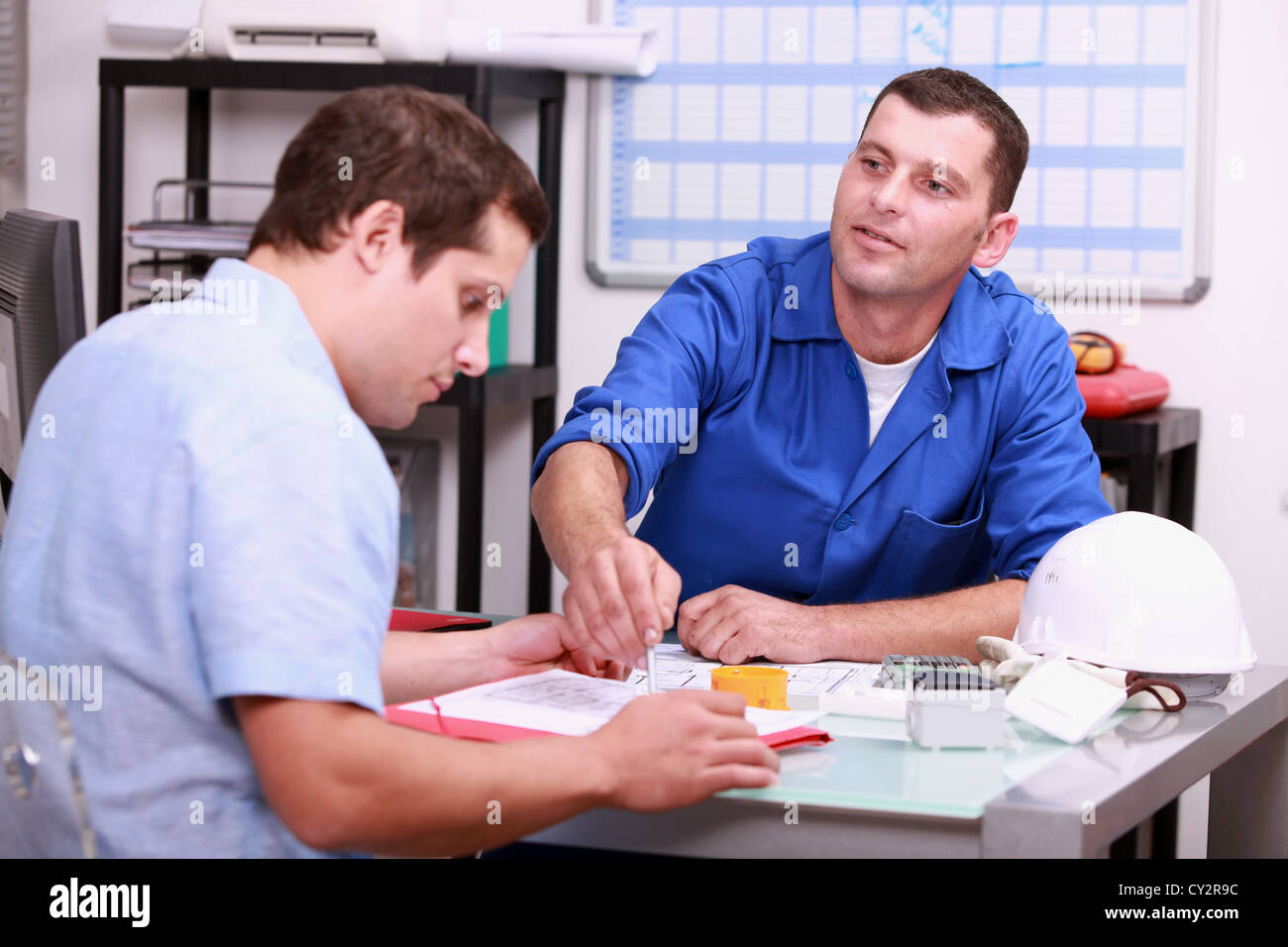 portrait two men looking at plans Stock Photo - Alamy