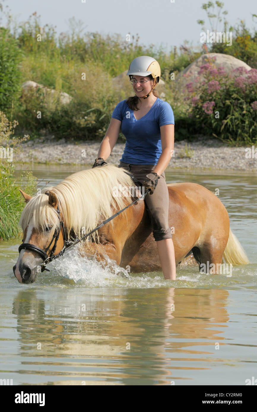 Riding horse in water hi-res stock photography and images - Alamy