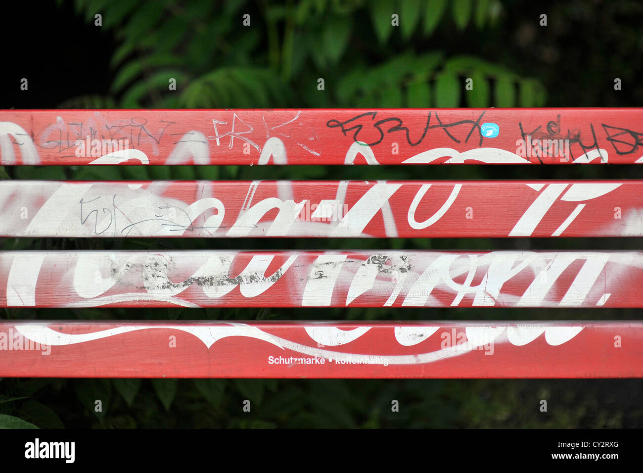 graffiti on coca cola bench berlin Stock Photo - Alamy