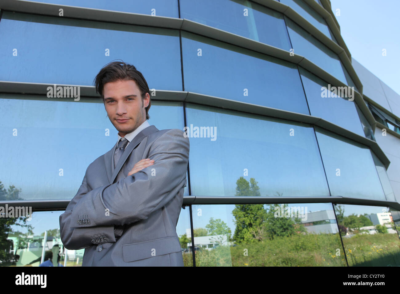 Smiling businessman facing camera hi-res stock photography and images ...