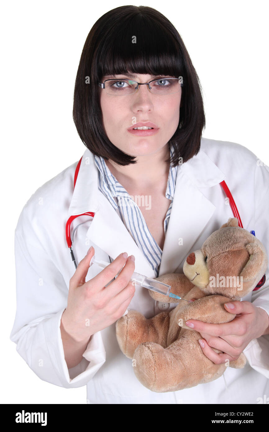 nurse giving an injection to a teddy bear Stock Photo - Alamy