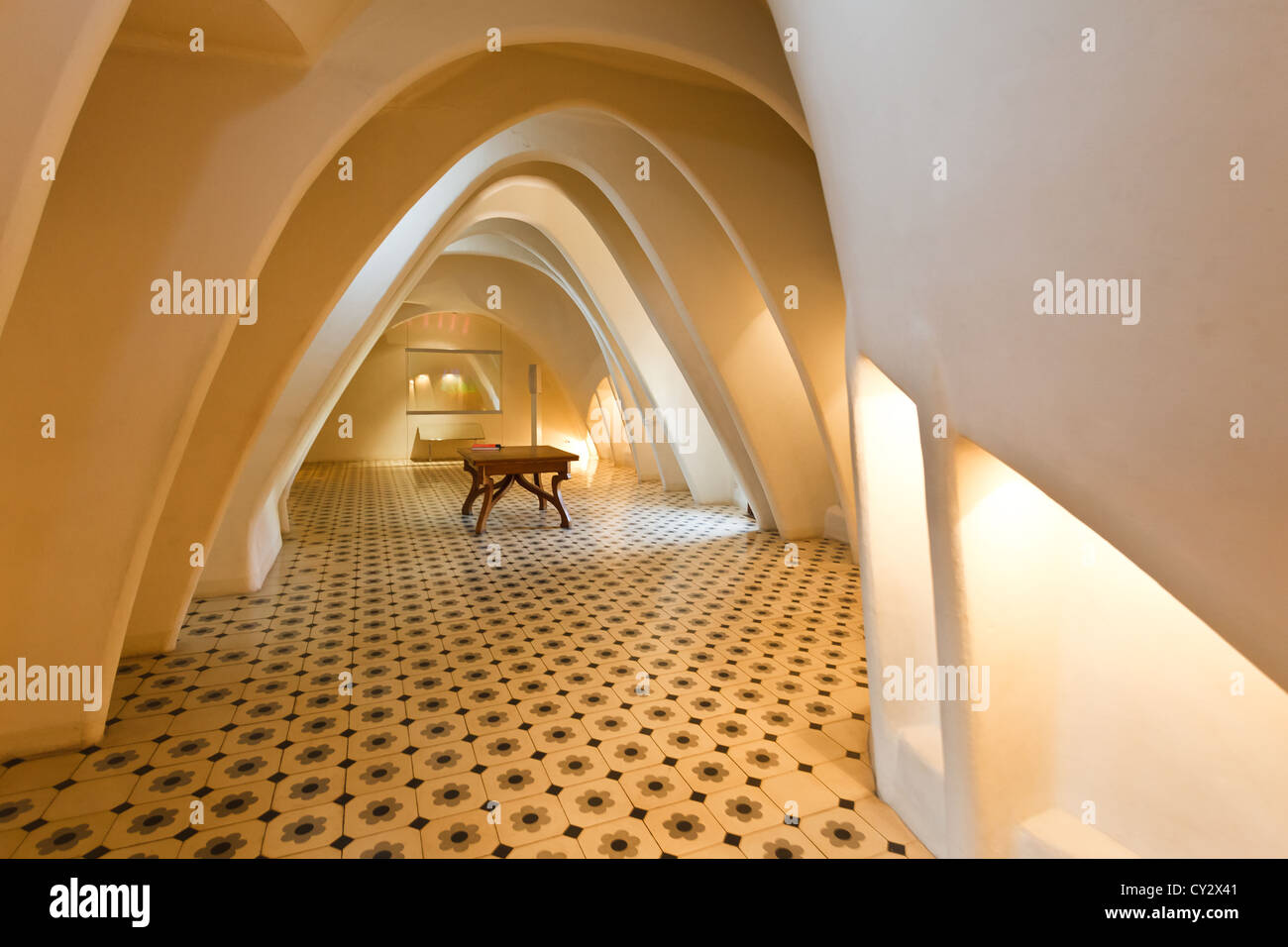 room featuring illuminated parabolic arches in ceiling and mosaic tile ...