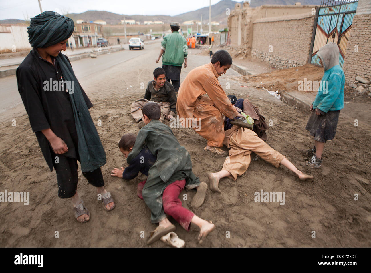 Afghan children playing in a slum in KabulAfghan children are wrestling ...