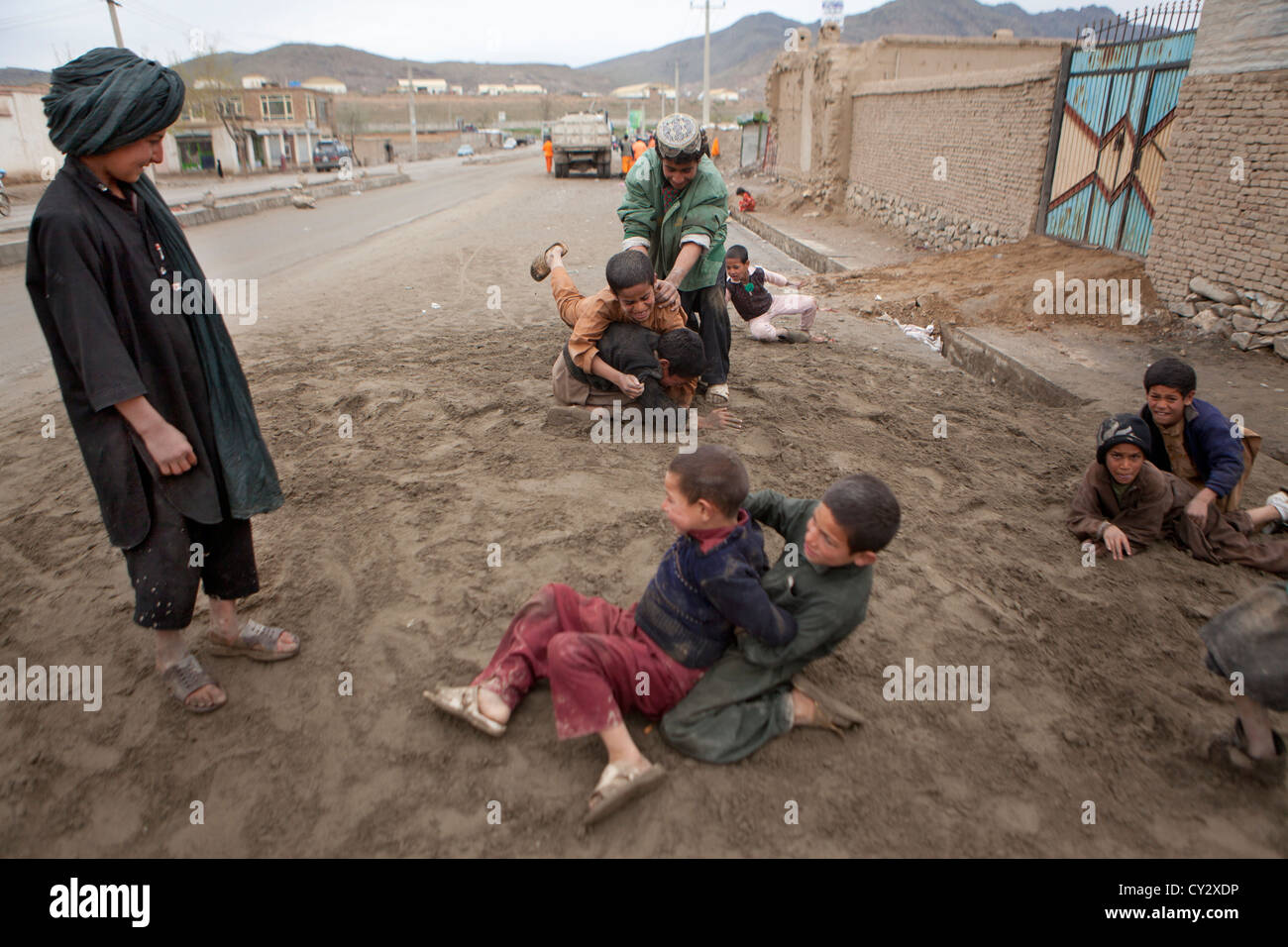 Afghan children playing in a slum in KabulAfghan children are wrestling ...