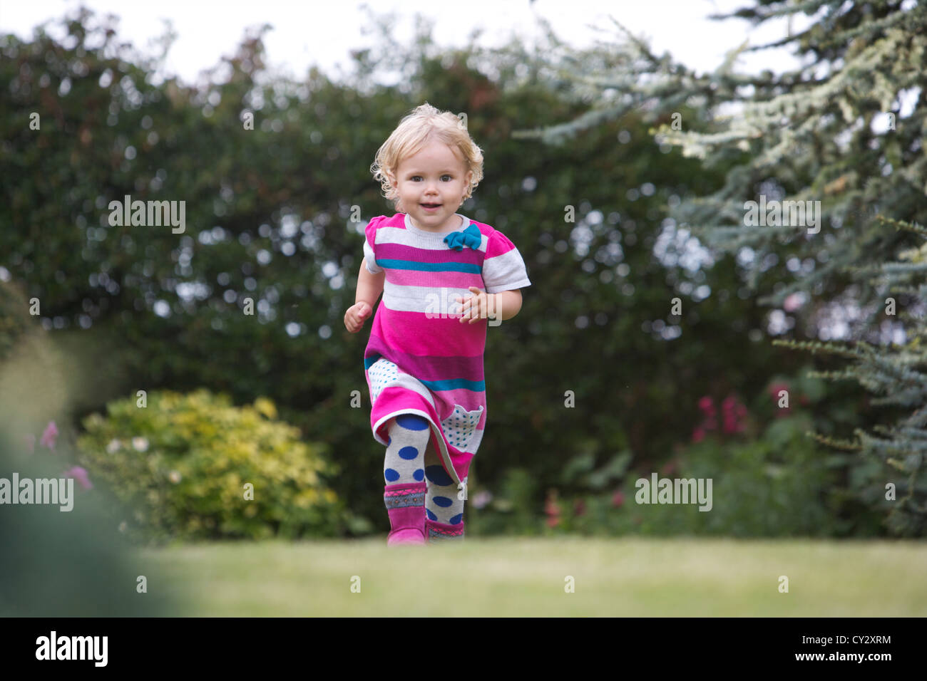 Child 9 running spring hi-res stock photography and images - Alamy
