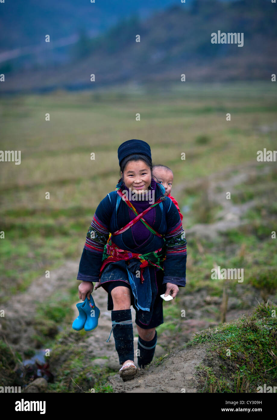 Black Hmong Girl Carrying A Baby On Her Back, Sapa, Vietnam Stock Photo ...