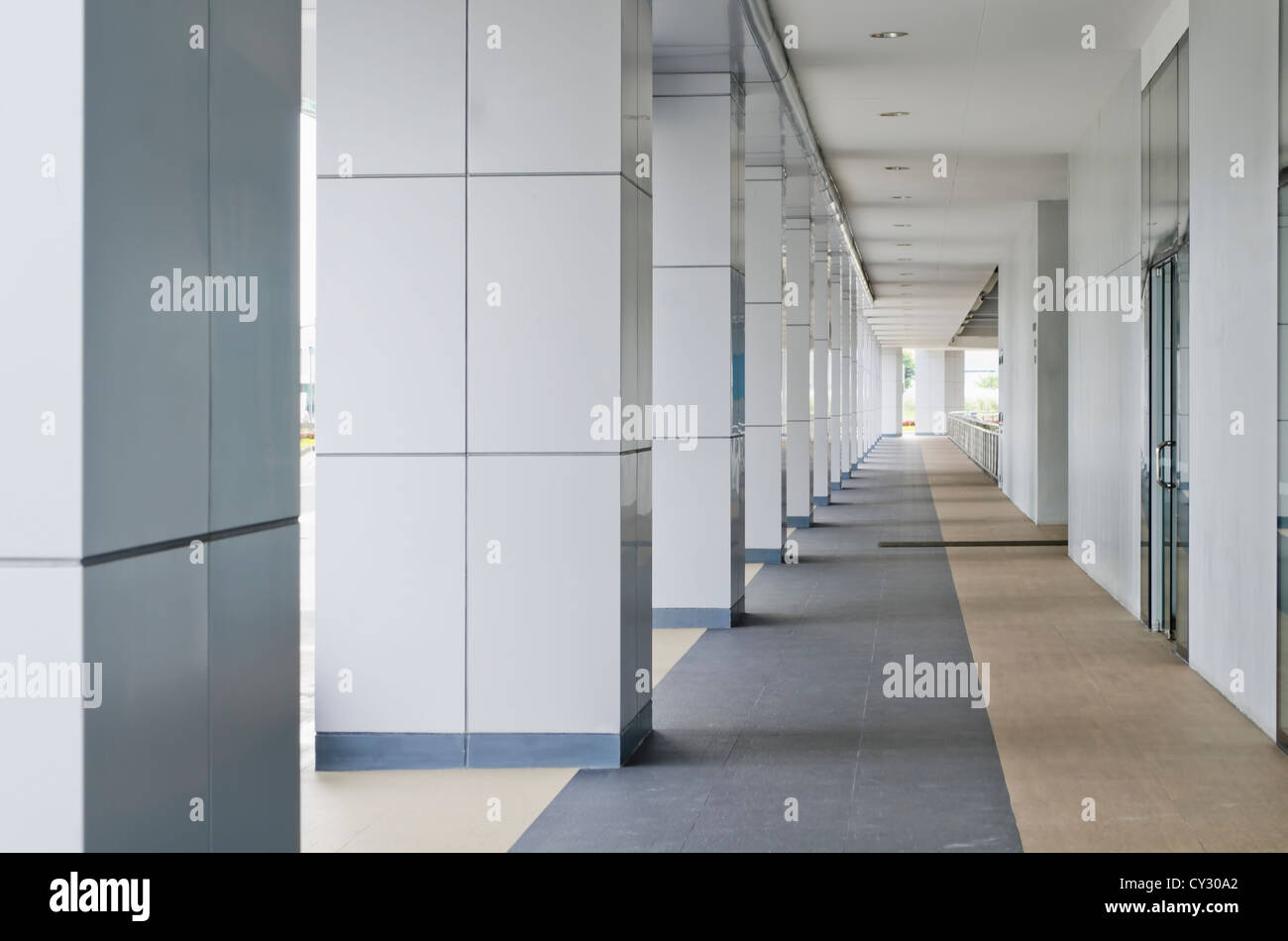 Passageway leading to a multi-level building parking lot Stock Photo ...