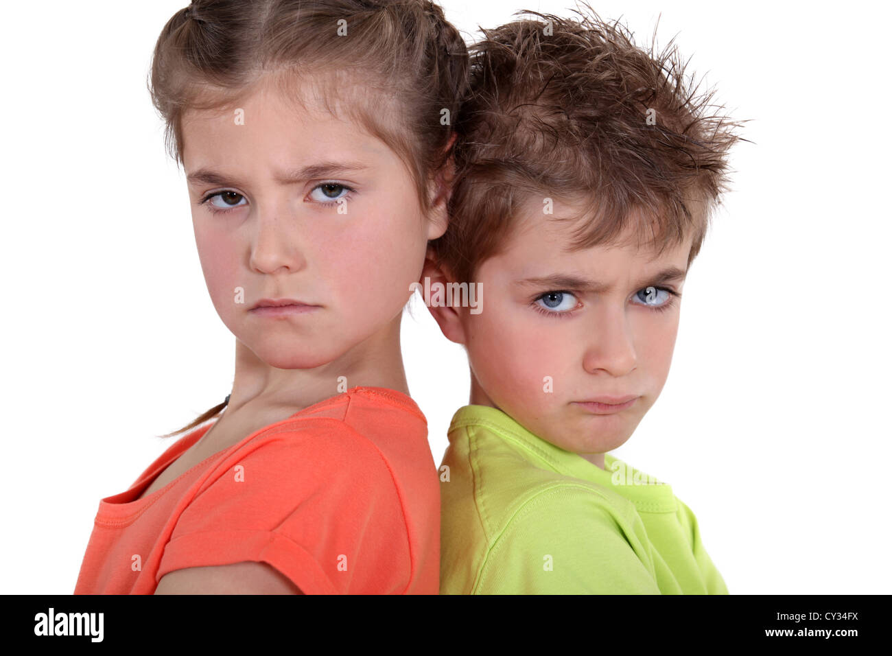 two angry kids posing together Stock Photo - Alamy